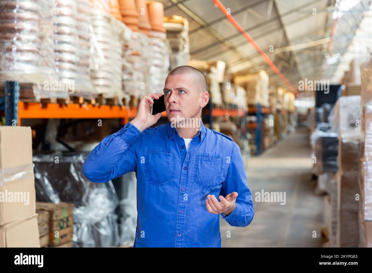 Storekeeper having telephone conversation during working day Stock ...