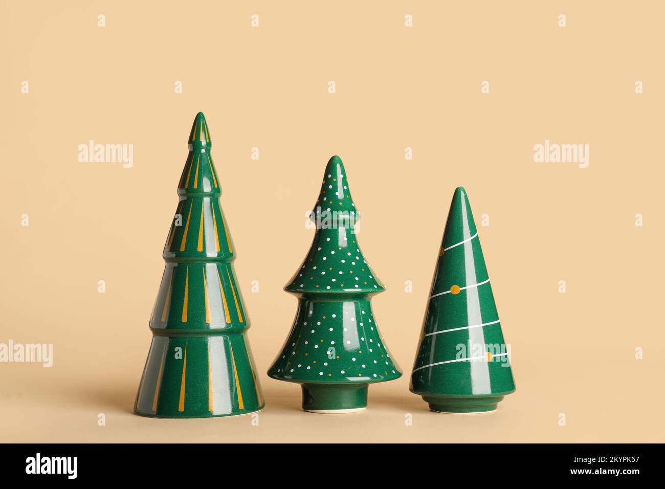 Beautiful decorative Christmas trees on color background Stock Photo ...