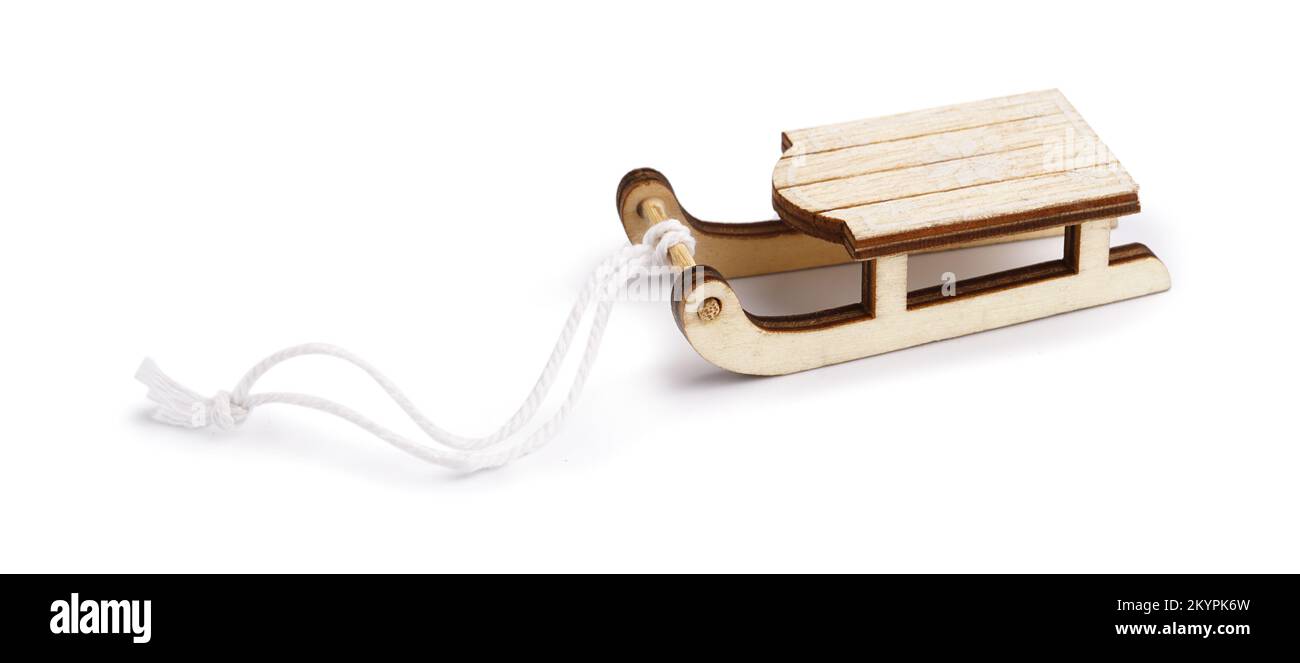 Wooden sledge toy on white background Stock Photo - Alamy