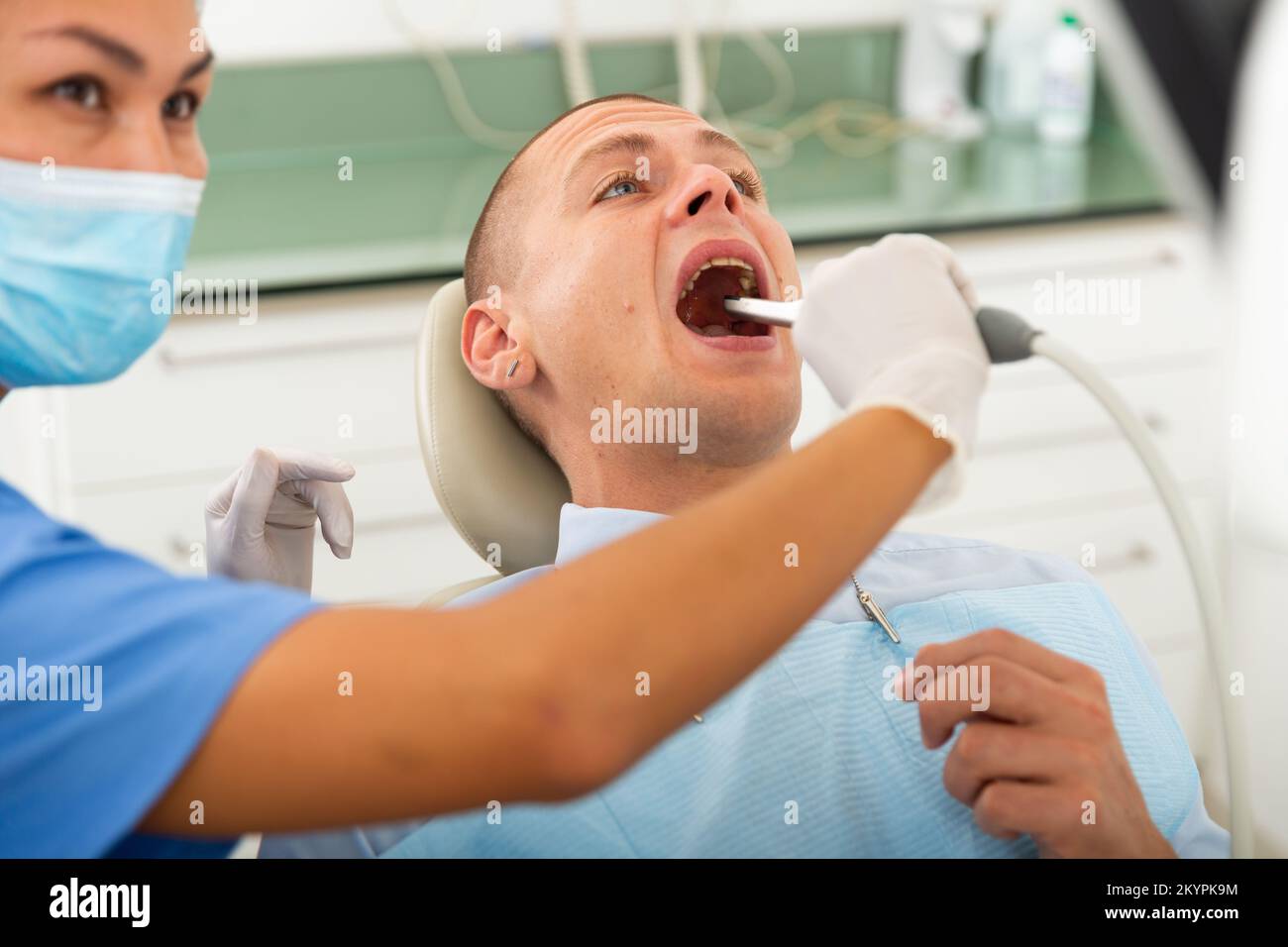 Doctor checks teeth female patient hi-res stock photography and images ...