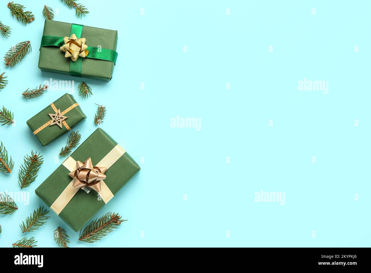 Christmas gift boxes with fir branches on blue background Stock Photo ...
