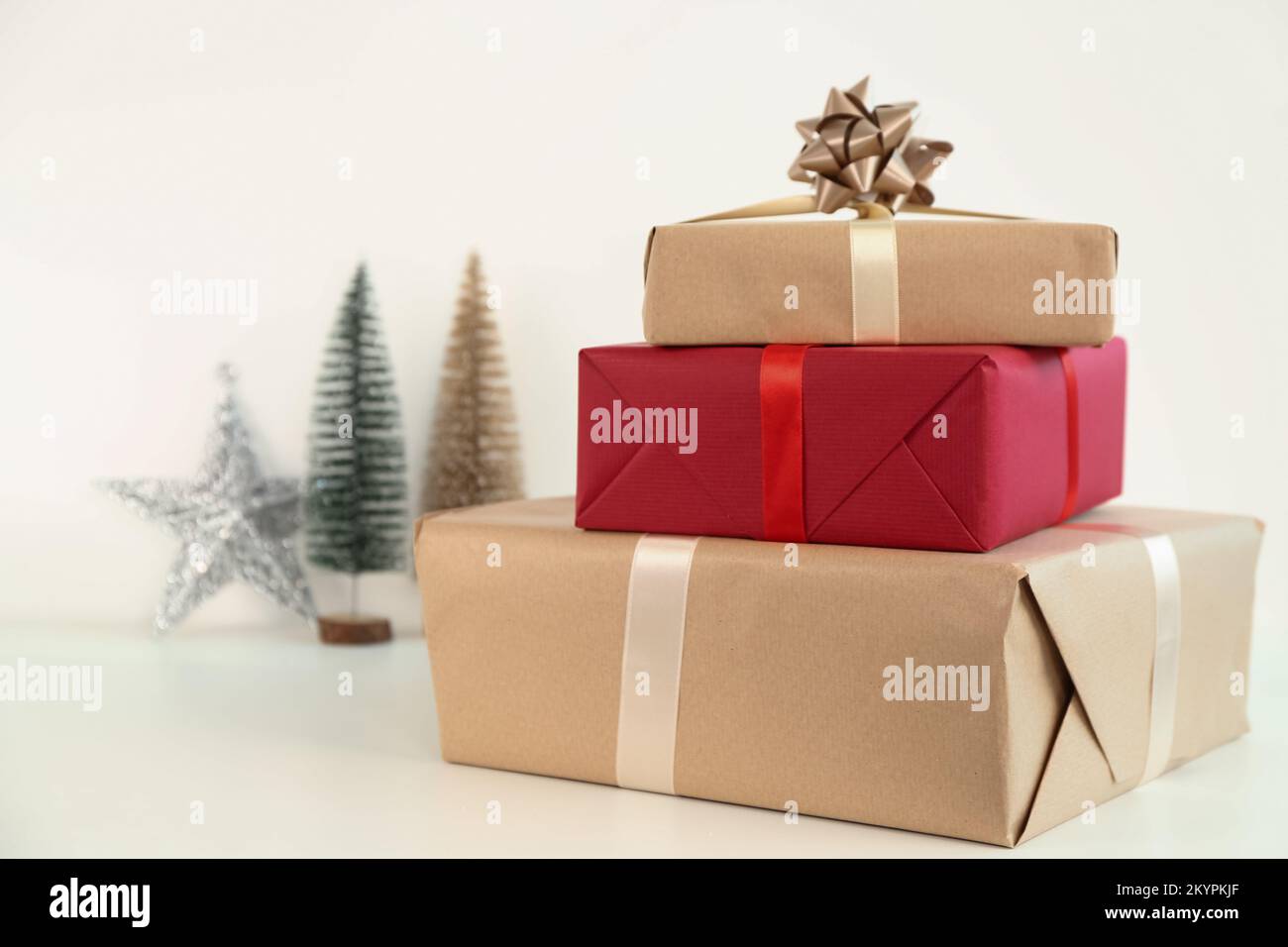 Christmas gift boxes on light background, closeup Stock Photo - Alamy