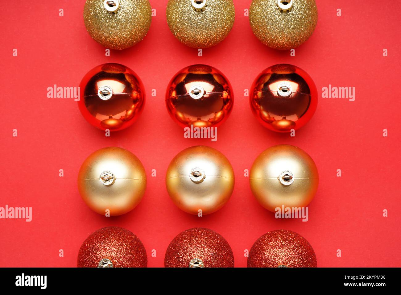 Shiny Christmas balls on red background Stock Photo - Alamy