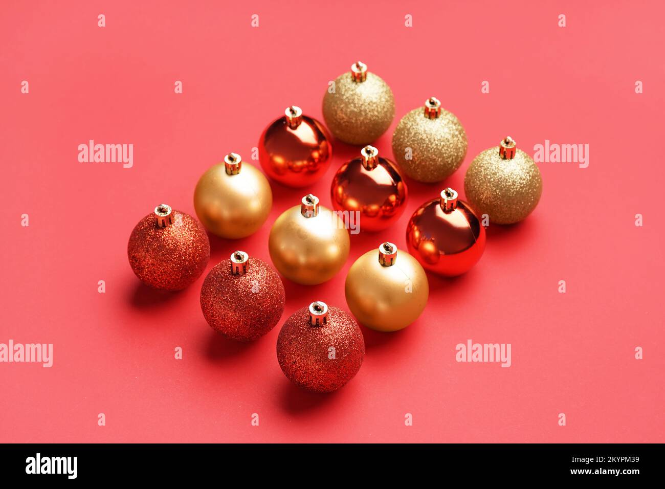 Shiny Christmas balls on red background Stock Photo - Alamy