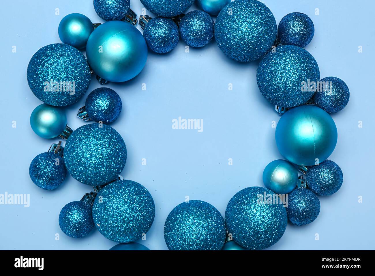 Frame made of shiny Christmas balls on blue background Stock Photo - Alamy