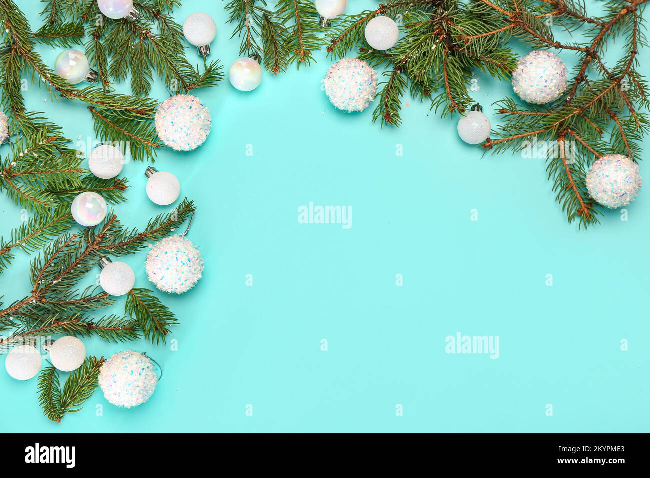 Frame made of white Christmas balls with fir branches on blue ...