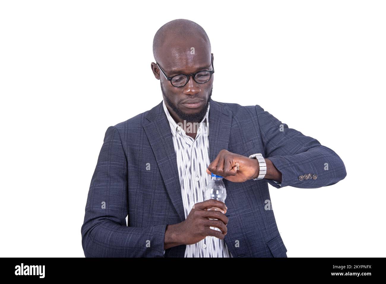 portrait of a serious adult businessman opening a plastic water bottle ...