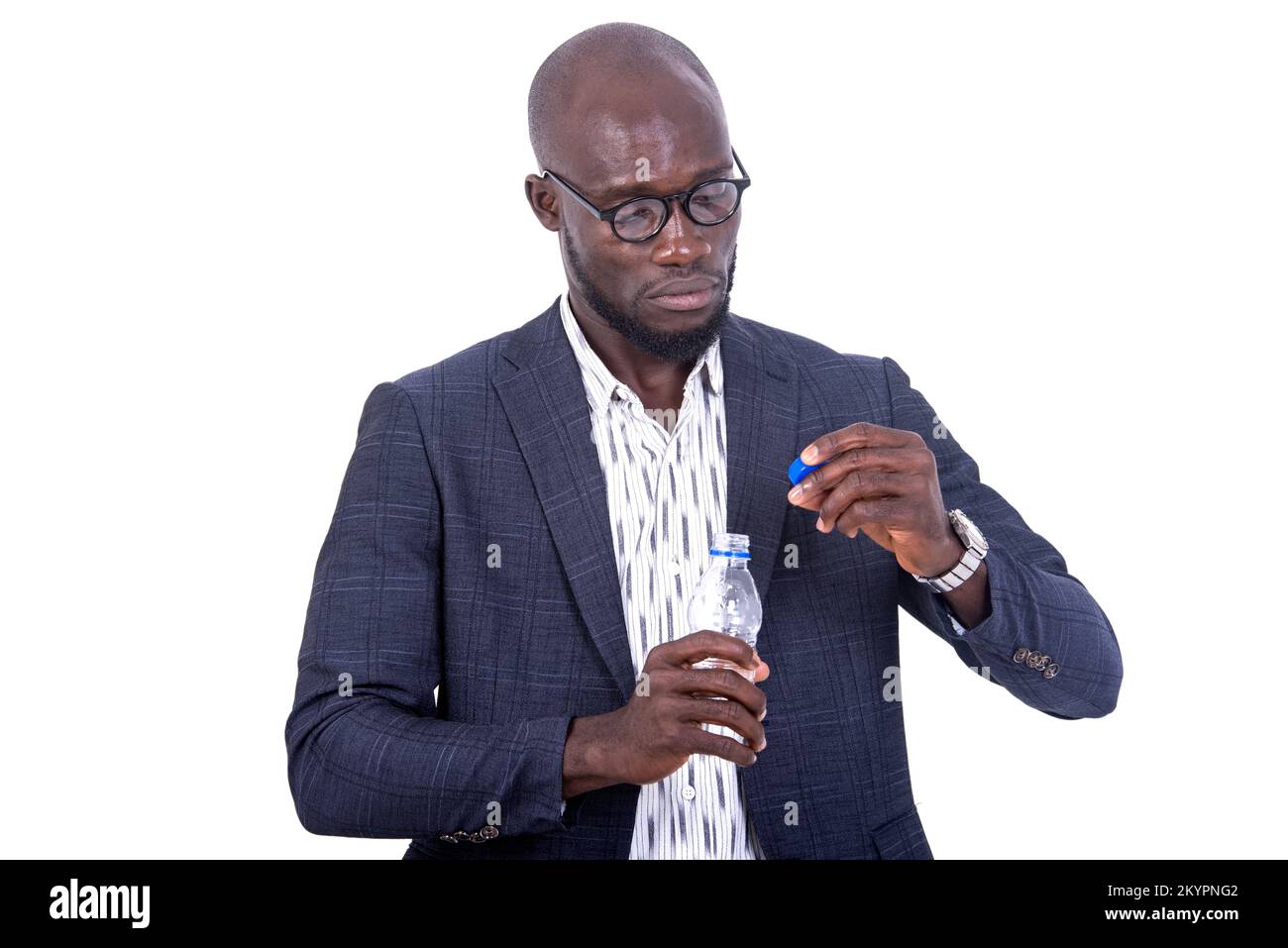 portrait of a serious adult businessman opening a plastic water bottle ...