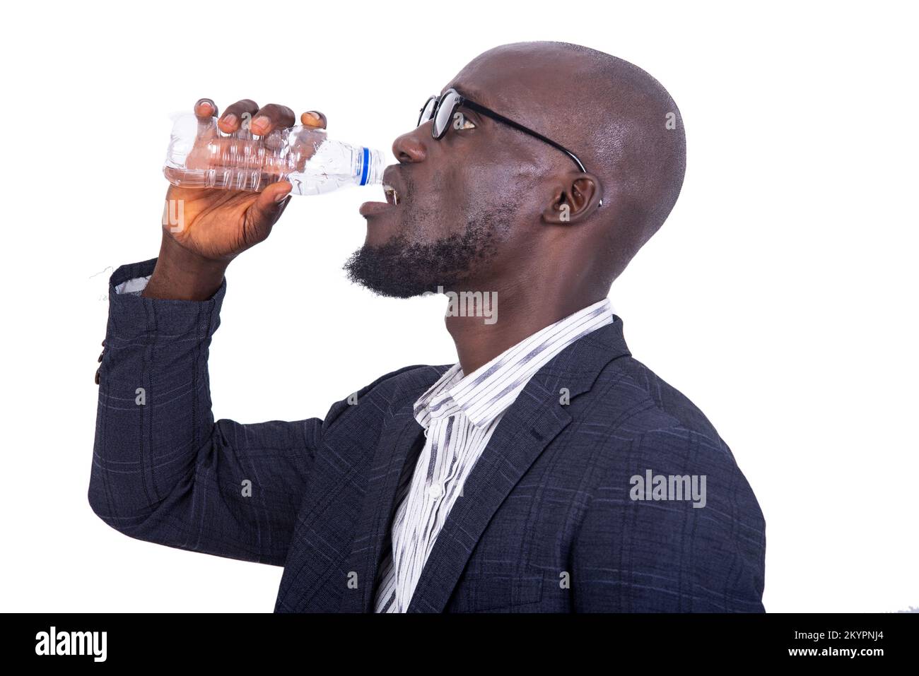 portrait of a serious adult businessman drinking water from a plastic ...