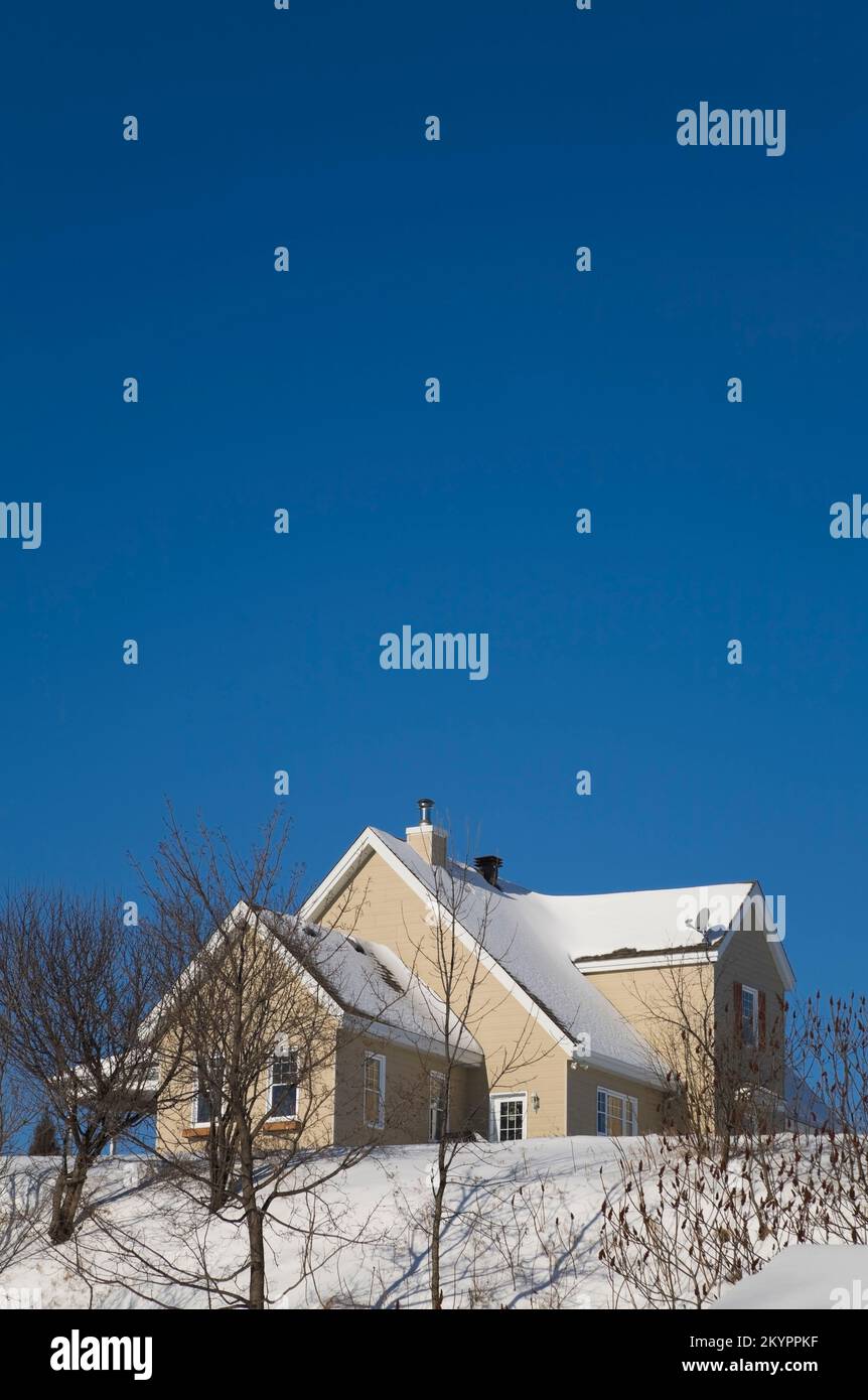 Two story beige with white trim country style home on a hilltop in ...