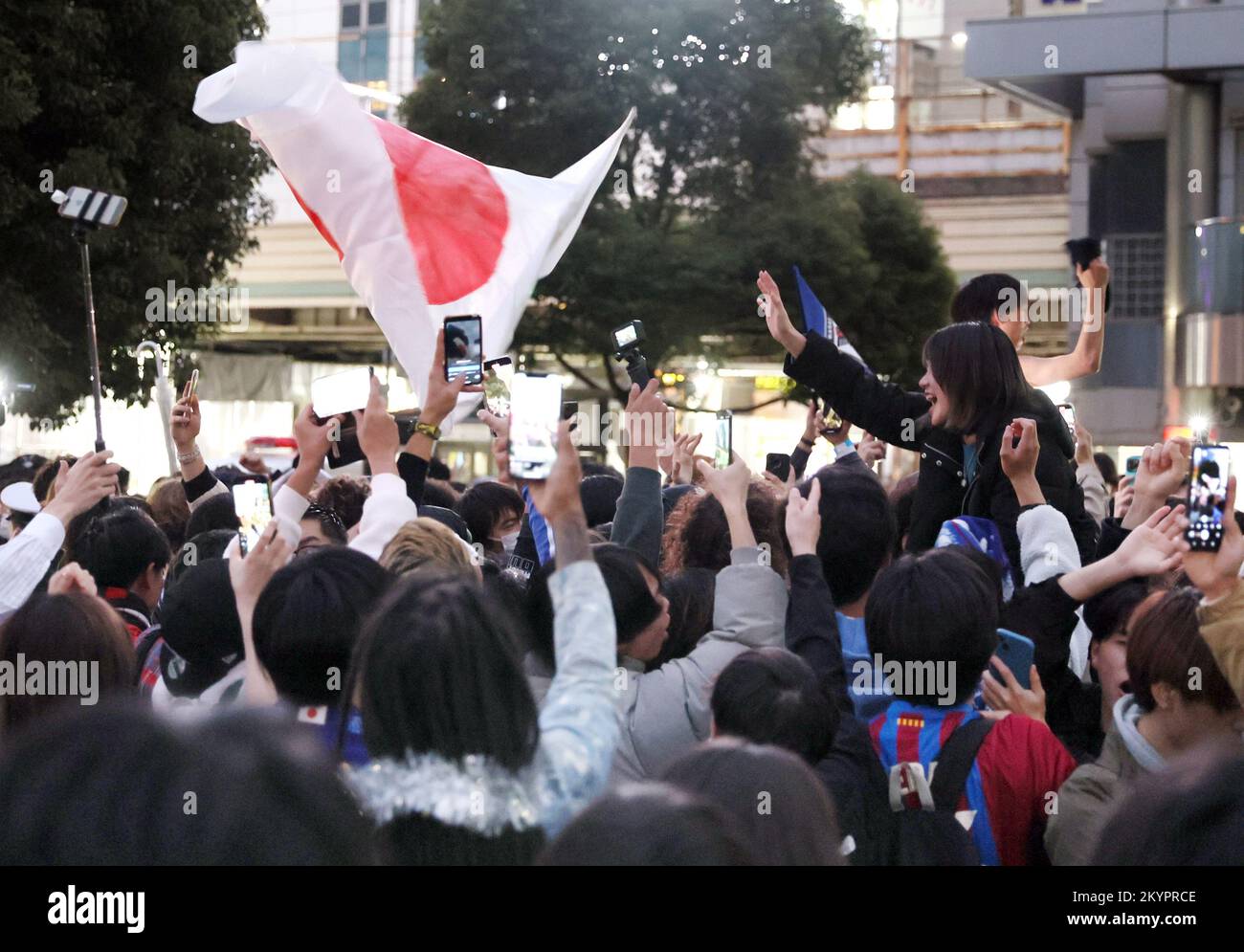 Tokyo, Japan. 2nd Dec, 2022. Japanese football fans celebrate Japan's ...