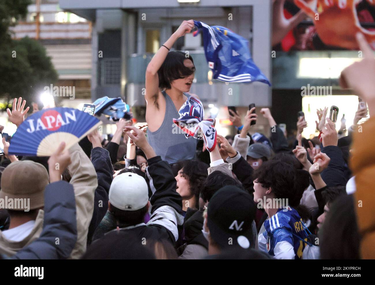Tokyo, Japan. 2nd Dec, 2022. Japanese football fans celebrate Japan's ...