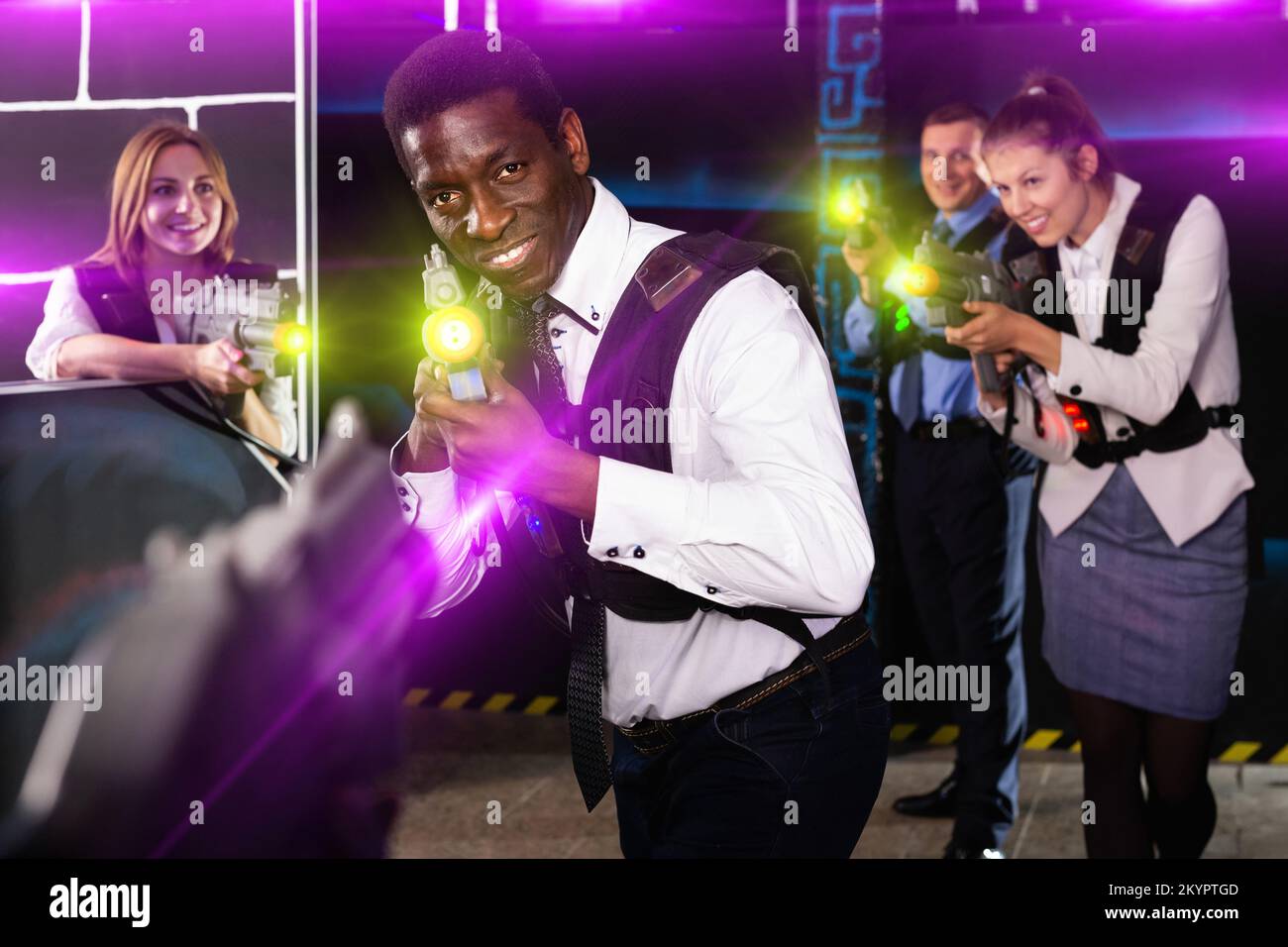 Afro businessman playing laser tag Stock Photo - Alamy