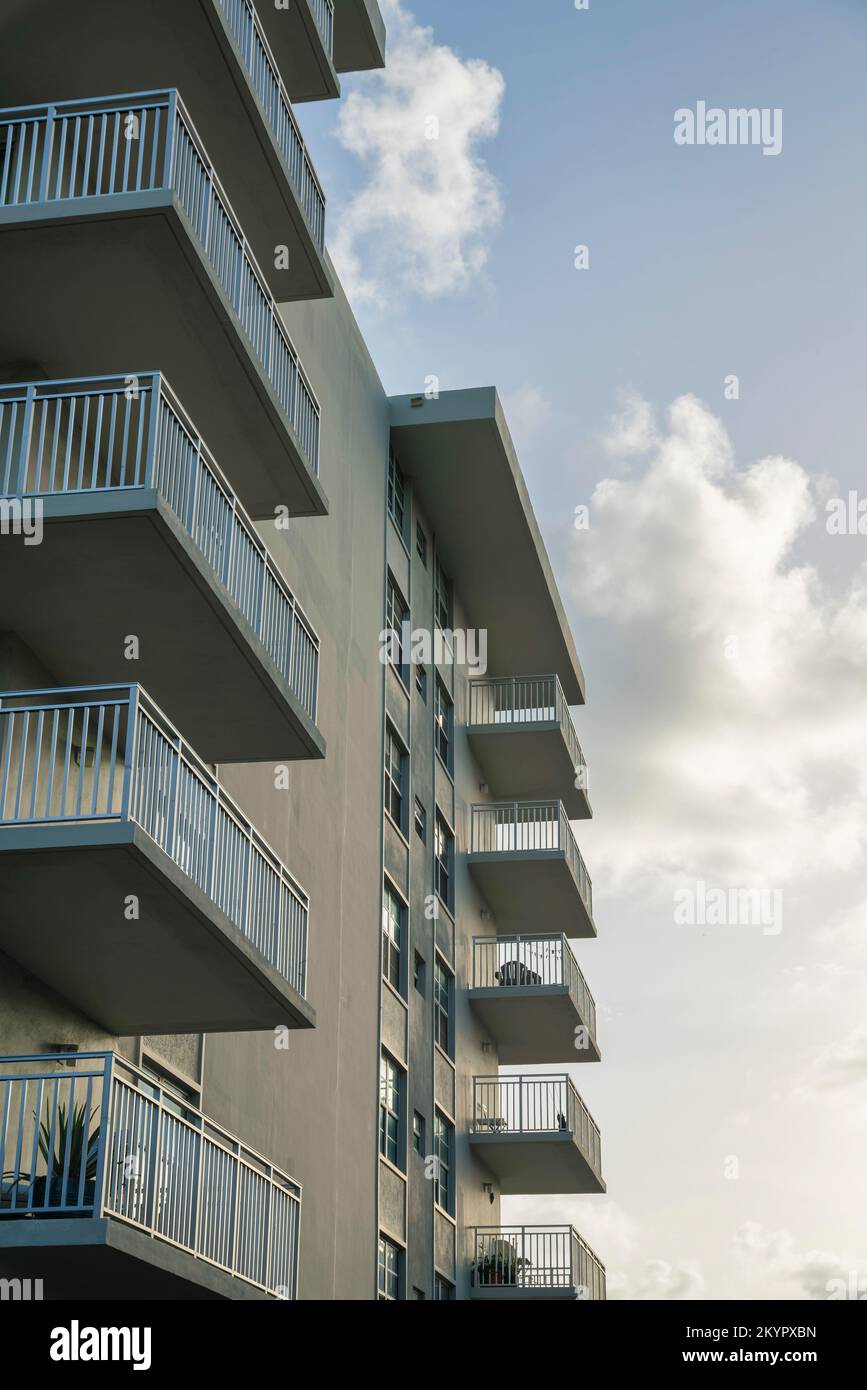 Vertical shot of a building with steel railings on the balconies ...