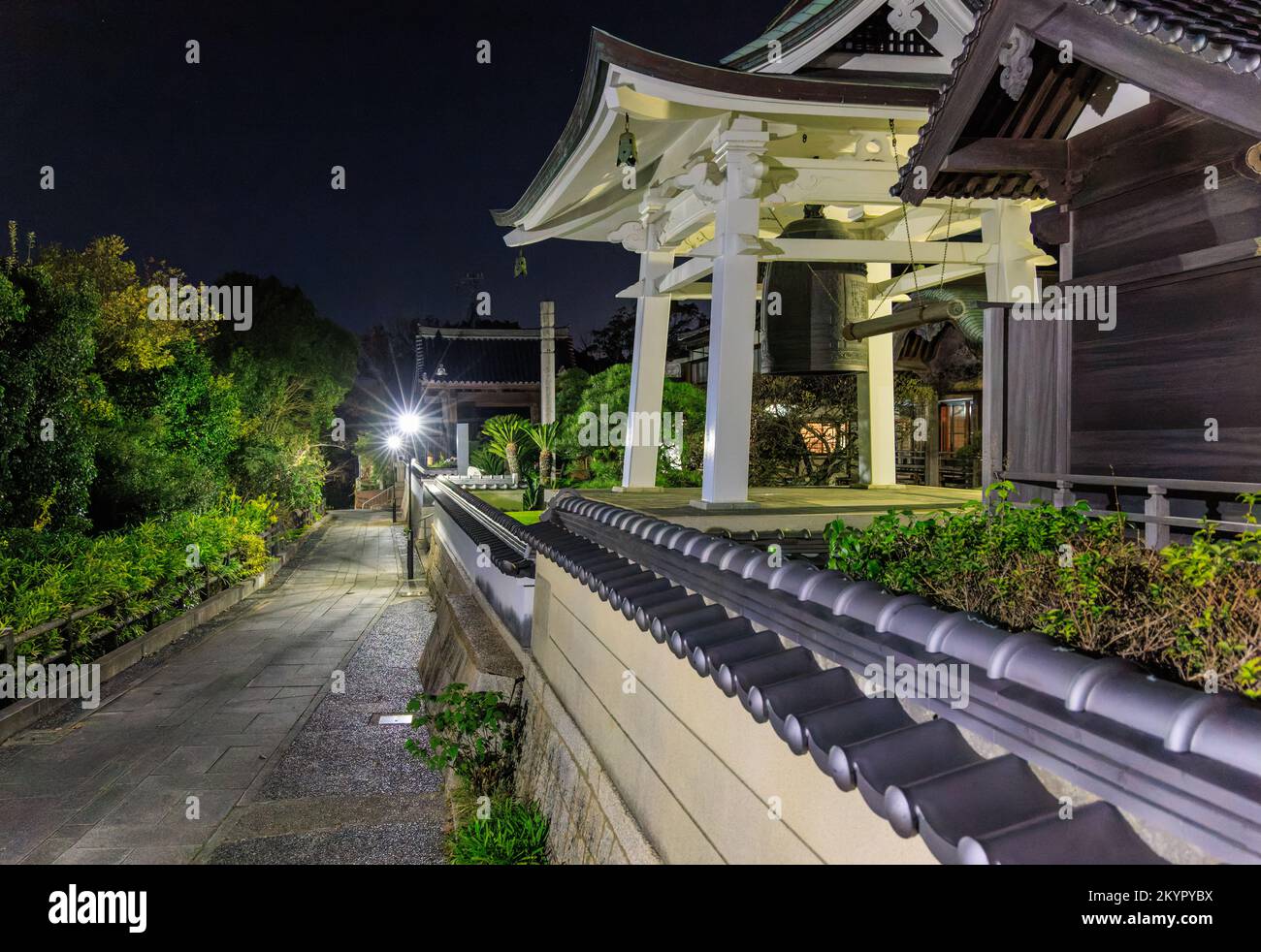 Exterior wall and large bell of Japanese temple at night Stock Photo ...