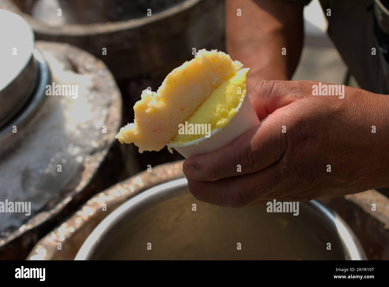 Rugged hands of a mexican ice cream maker Stock Photo - Alamy