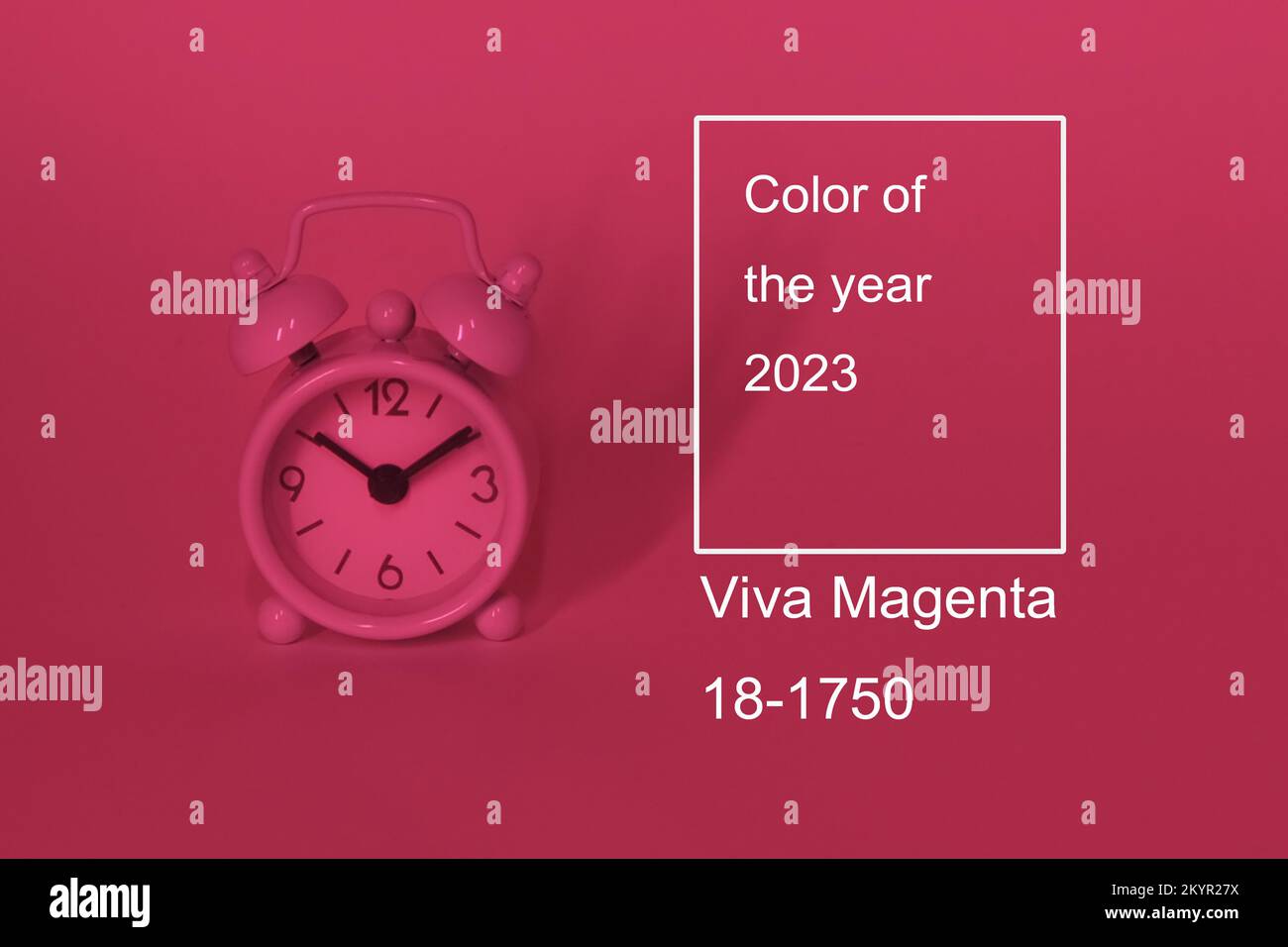 Viva magenta color of the year 2023. Alarm clock Stock Photo - Alamy