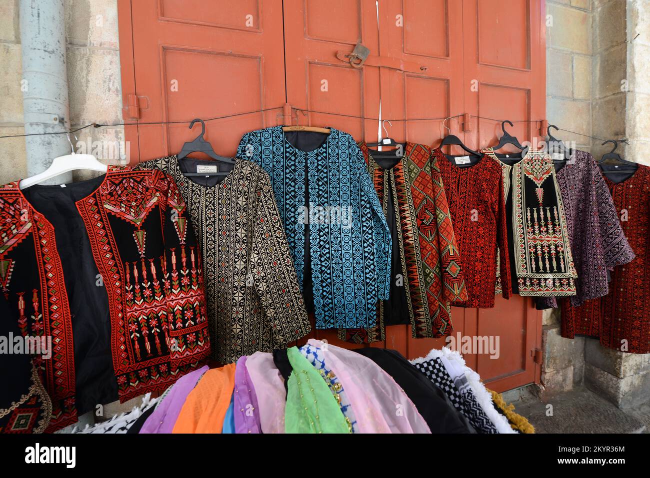 Traditional Palestinian clothes displayed for tourist at a souvenir ...