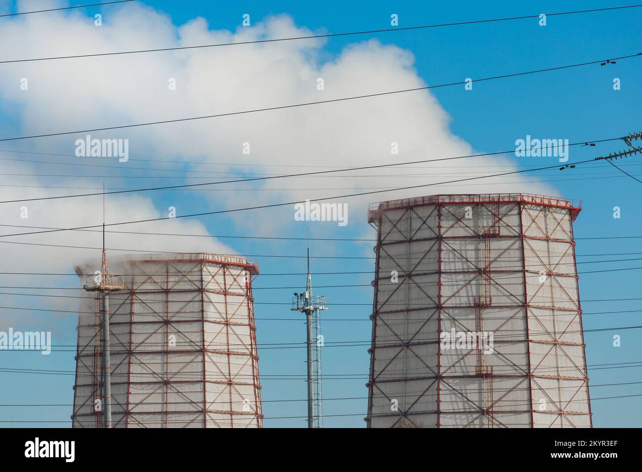 Toxic smoke is released from the cooling tower into the atmosphere and ...