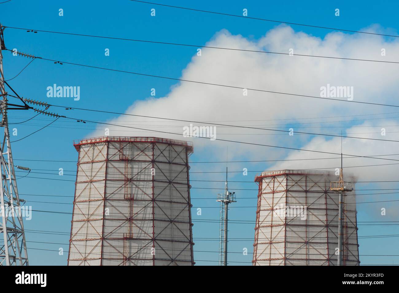 Toxic smoke is released from the cooling tower into the atmosphere and ...