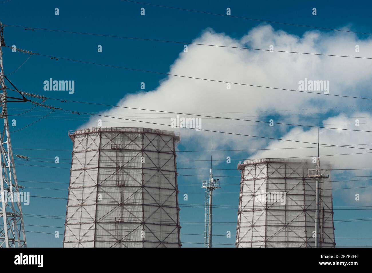 Toxic smoke is released from the cooling tower into the atmosphere and ...