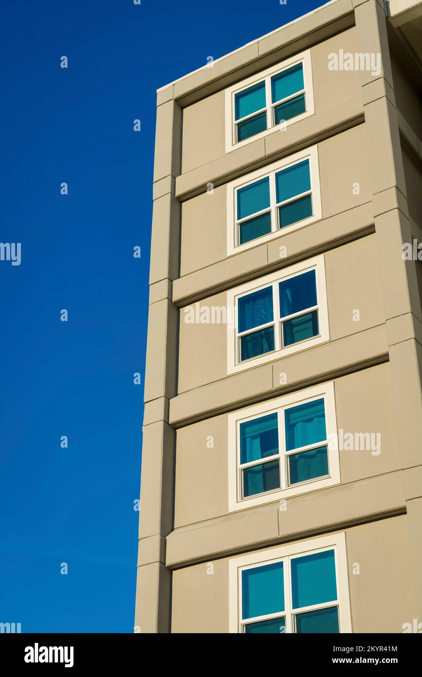 Building exterior with square paned windows in a low angle view at ...