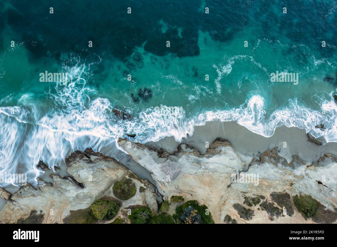 Flying above turquoise ocean waves, top down view Stock Photo - Alamy