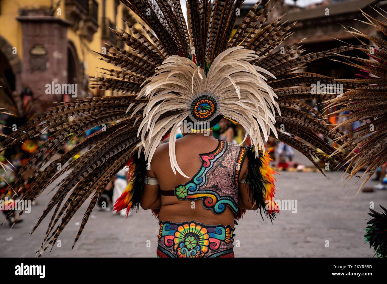 Indigenous man wearing an intricate head dress at the Danza de Indios ...