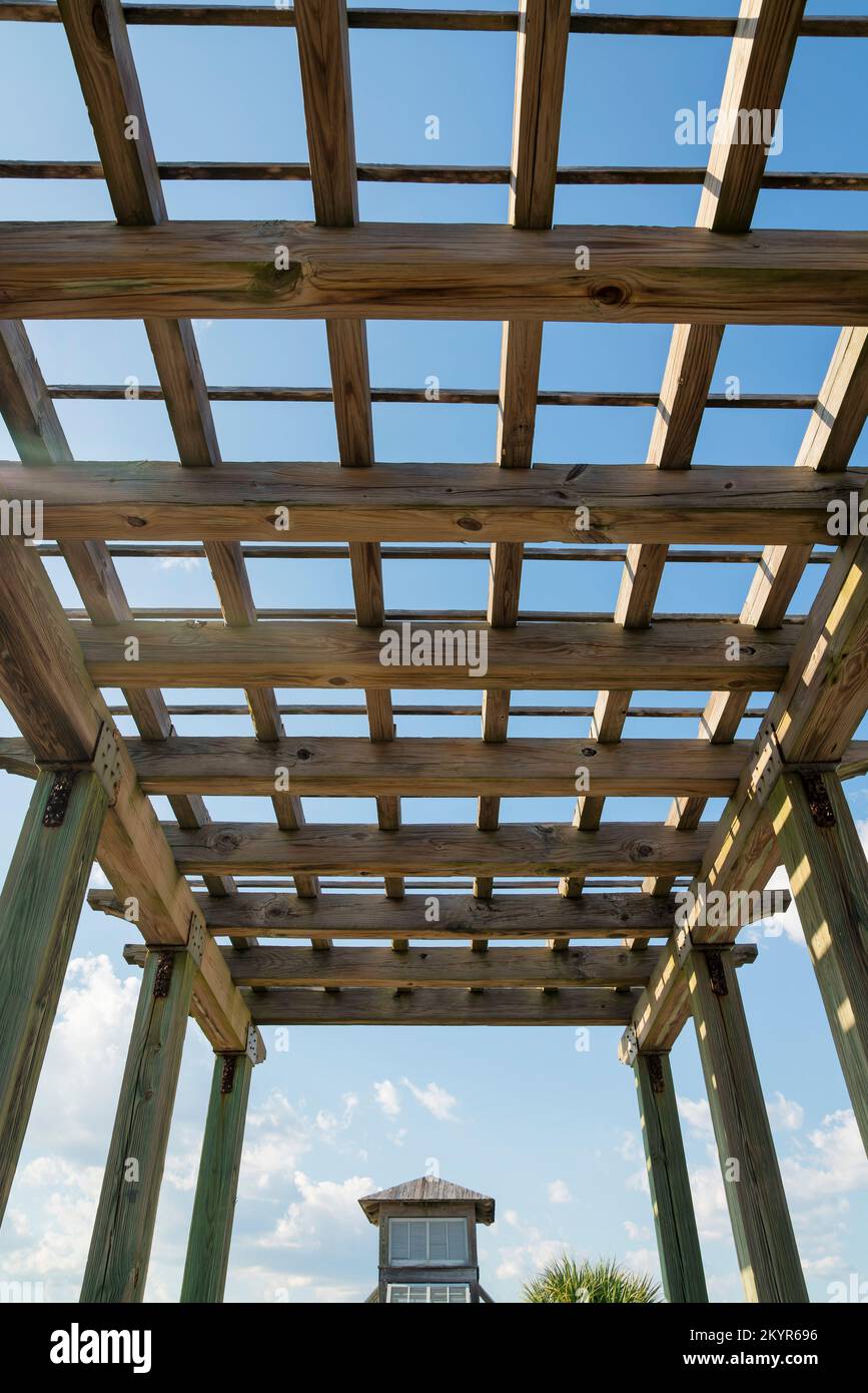 Destin, Florida- View of a wooden outdoor roof grid under the clear sky ...