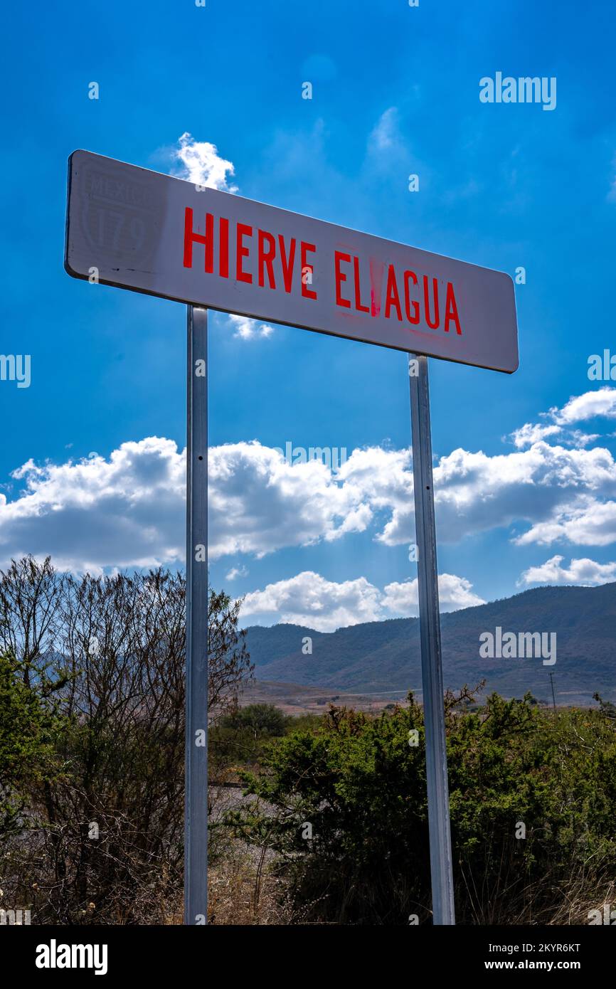 Bright colored road sign in the town of Hierve el Agua, in Oaxaca ...