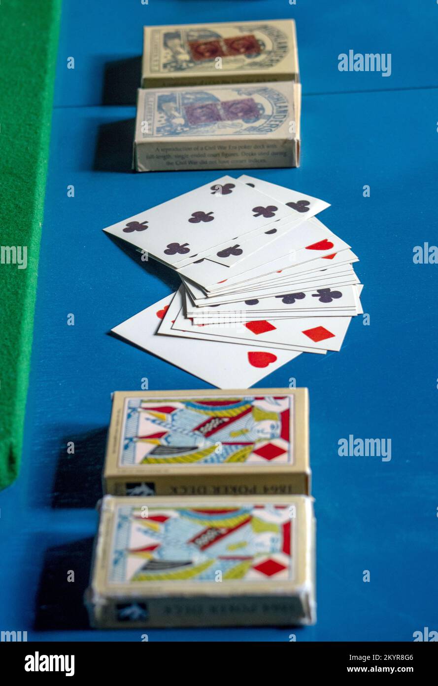 decks of antique playing cards are set out in a vintage saloon Stock ...