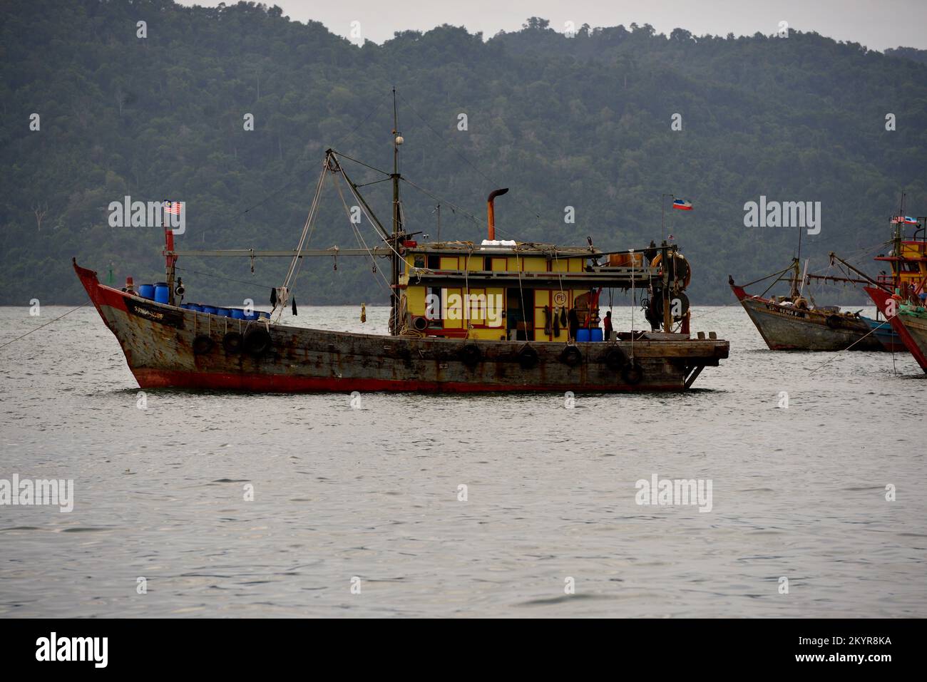 A fishing trawler in the South China Sea harbour in Kota Kinabalu ...