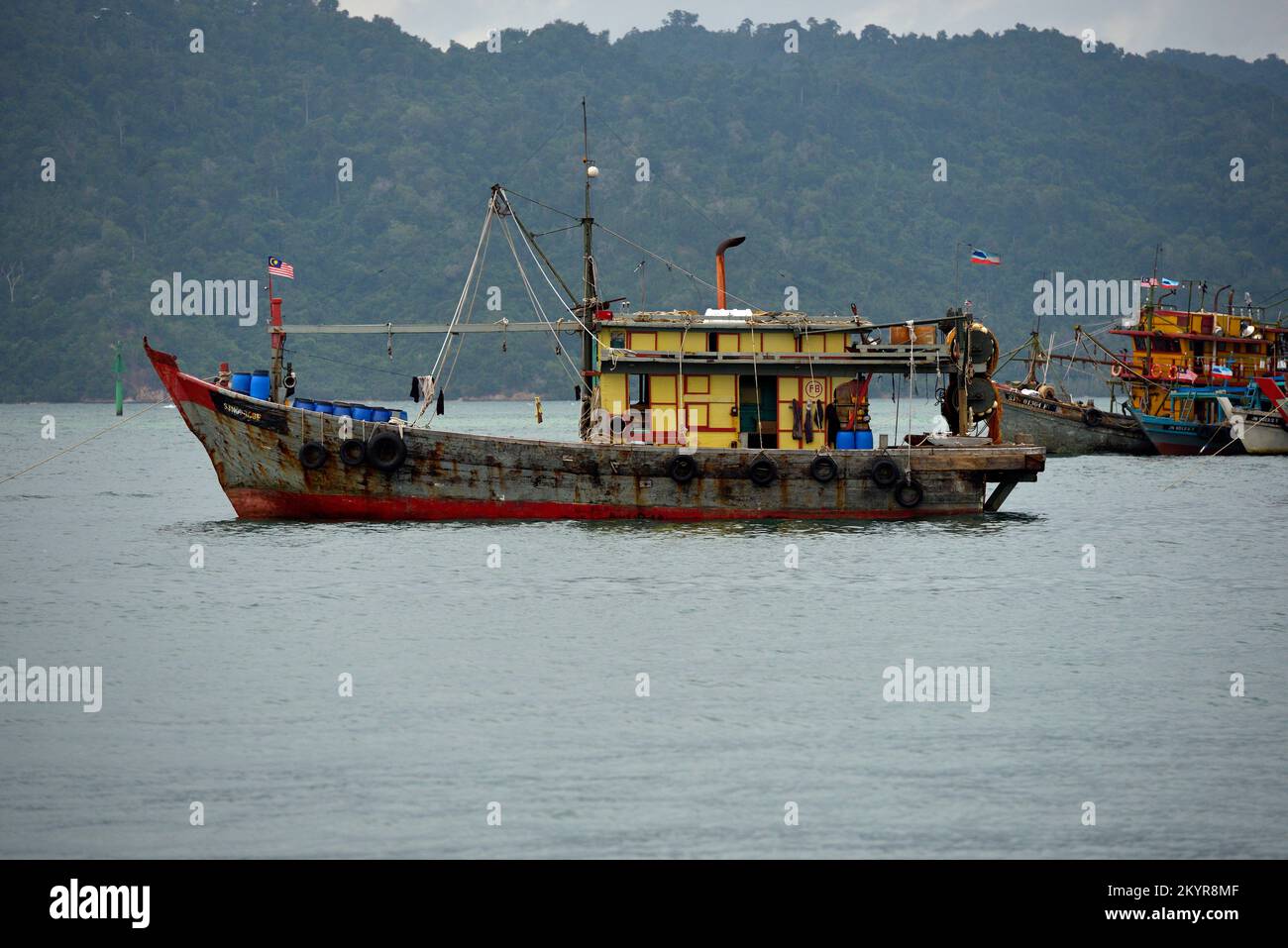 A fishing trawler in the South China Sea harbour in Kota Kinabalu ...