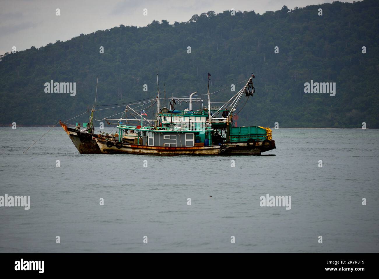 A fishing trawler in the South China Sea harbour in Kota Kinabalu ...