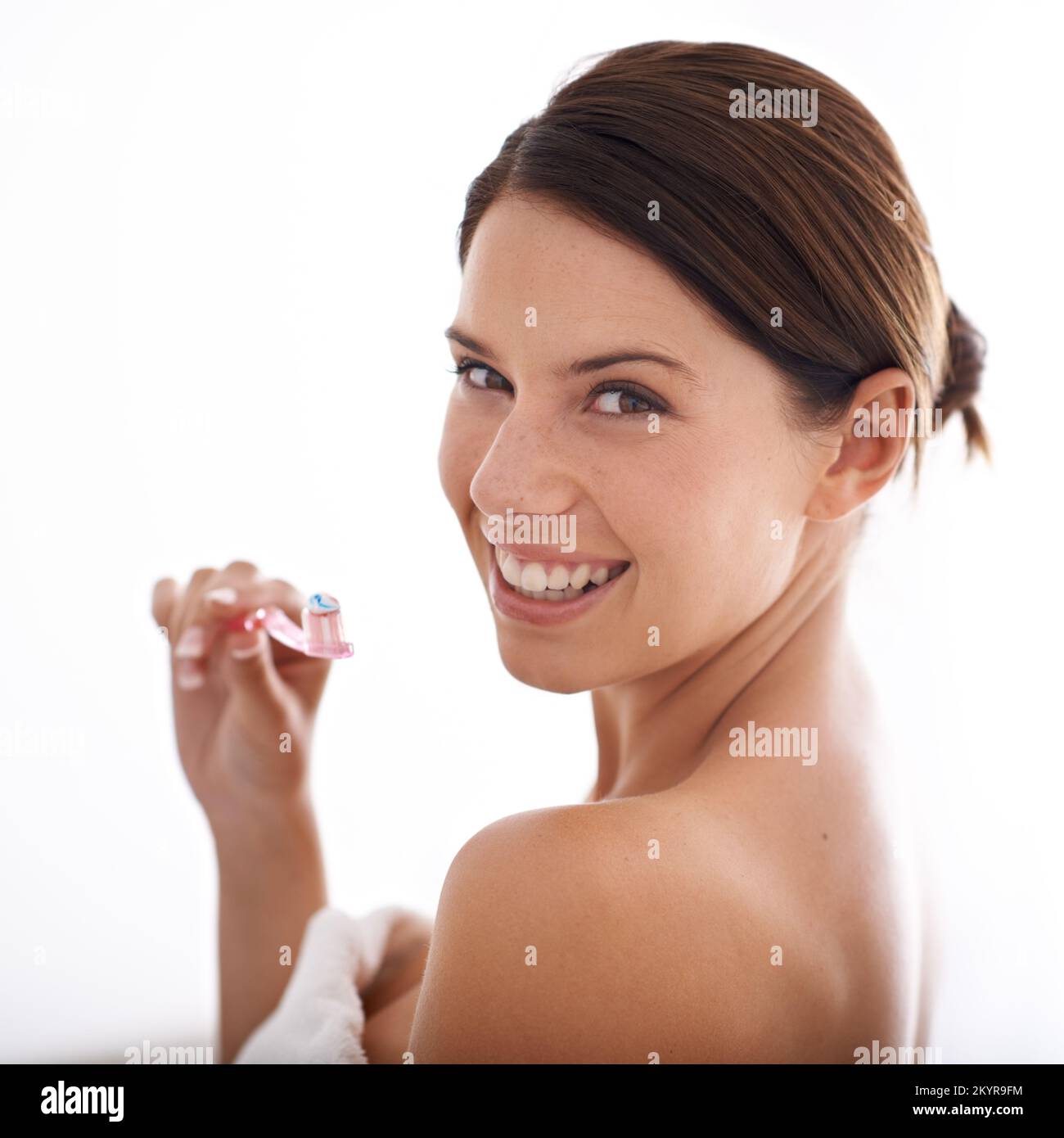 Im All About Dental Hygiene A Gorgeous Young Brunette Brushing Her Teeth In The Morning Stock