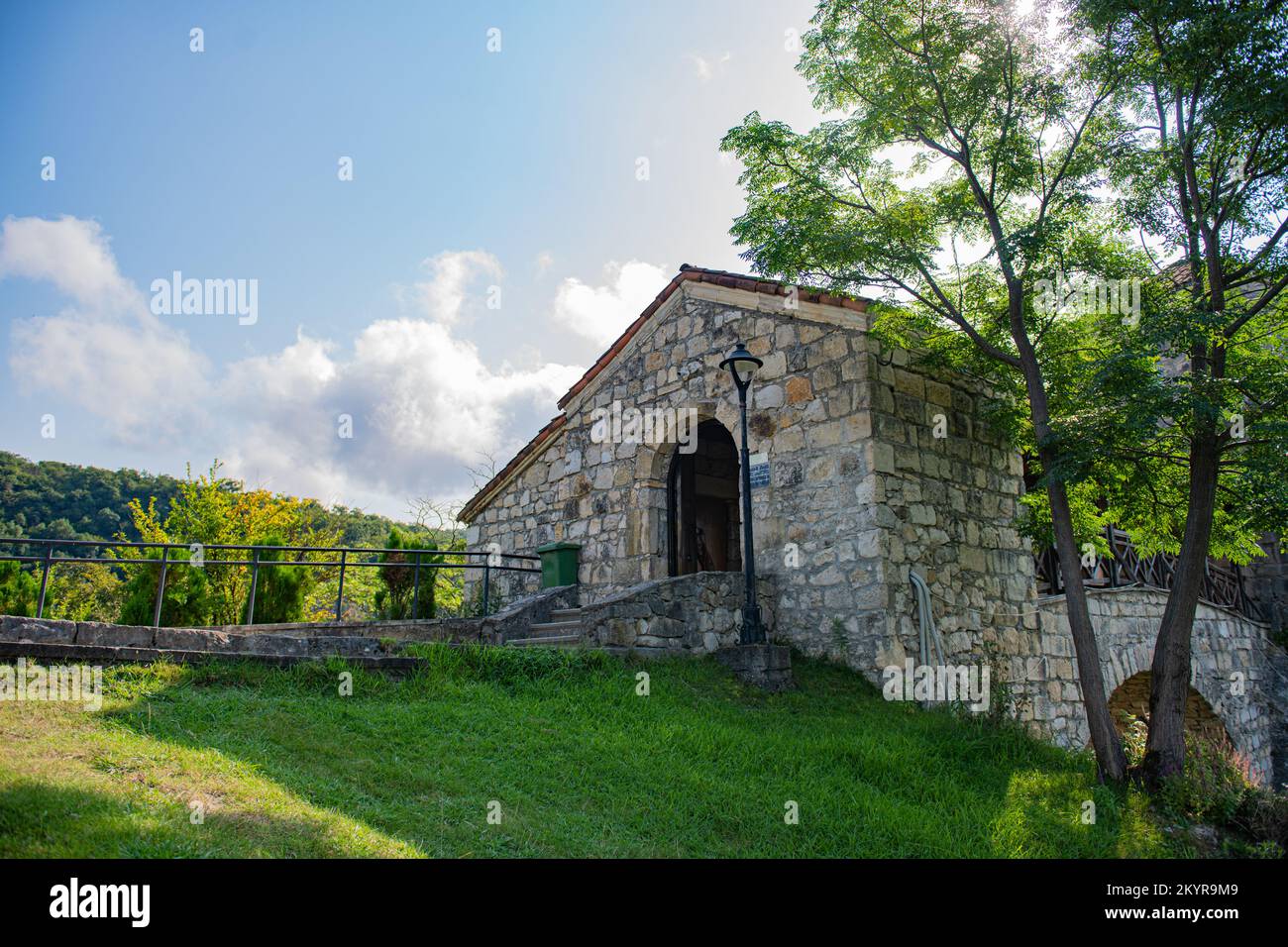 stone structure with door lantern green grass olac sky Stock Photo - Alamy