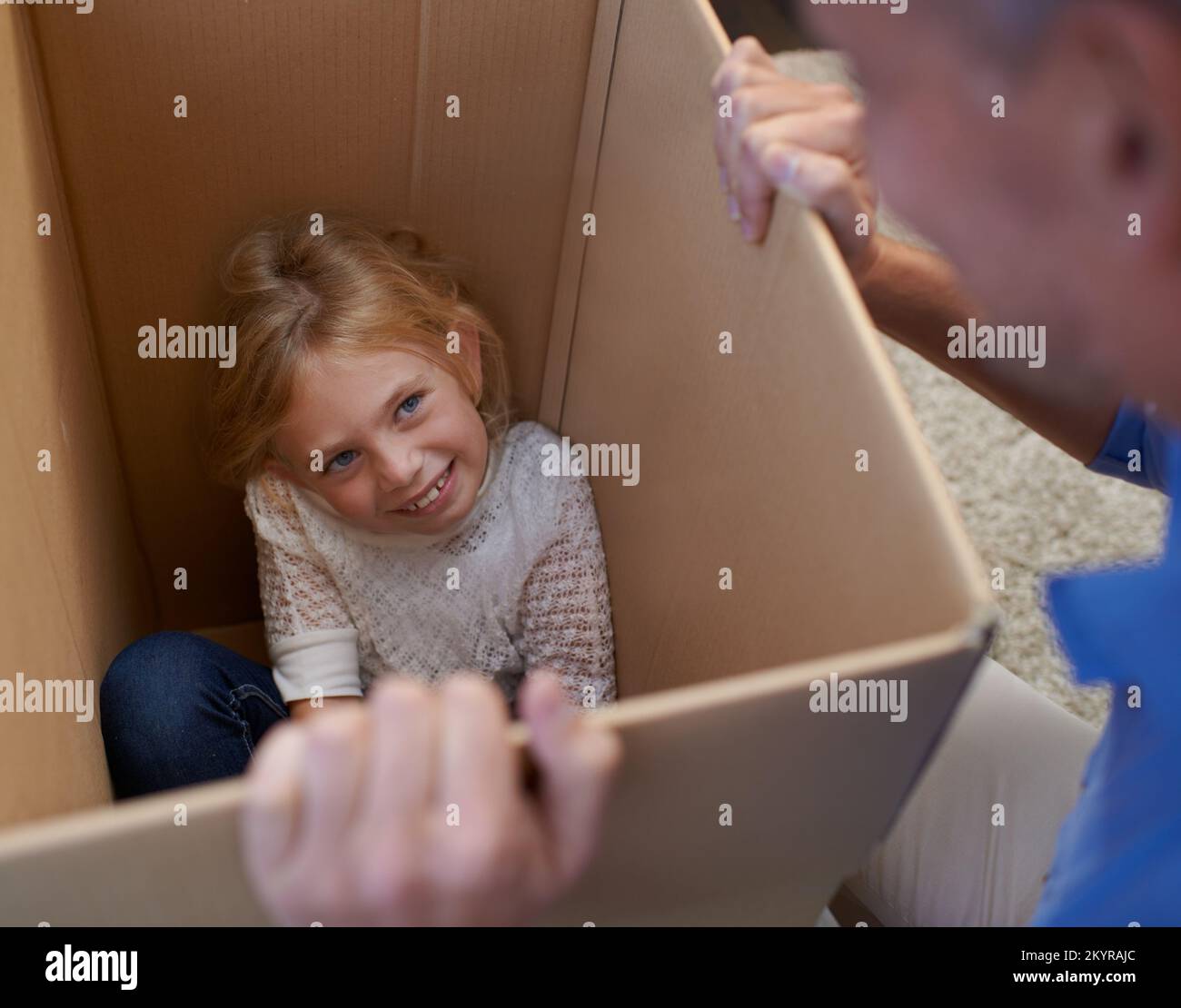 People hiding in boxes hi-res stock photography and images - Alamy