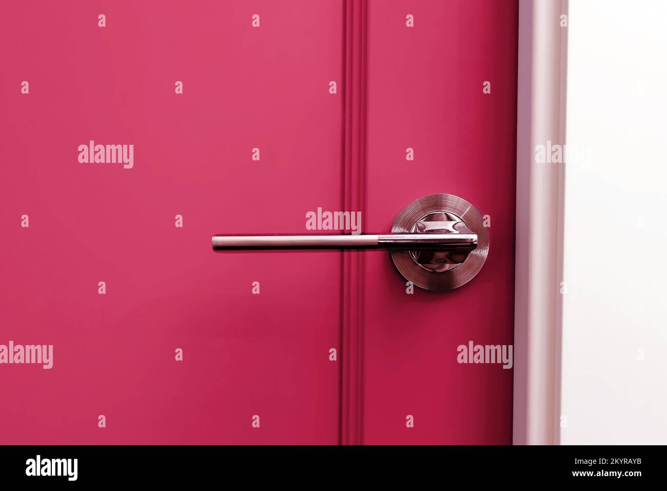 Magenta painter door with handle close-up. Vivid color Stock Photo - Alamy