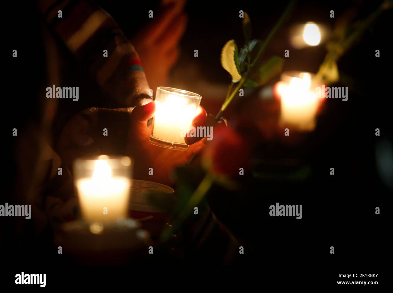 Family and friends of three murdered women gather at a vigil in ...
