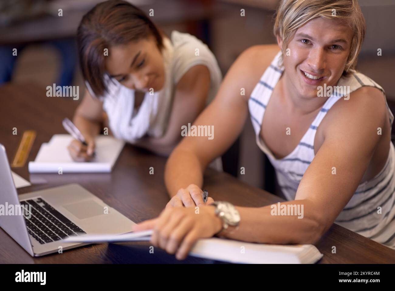 Working towards a bright future. A young man and woman studying for ...
