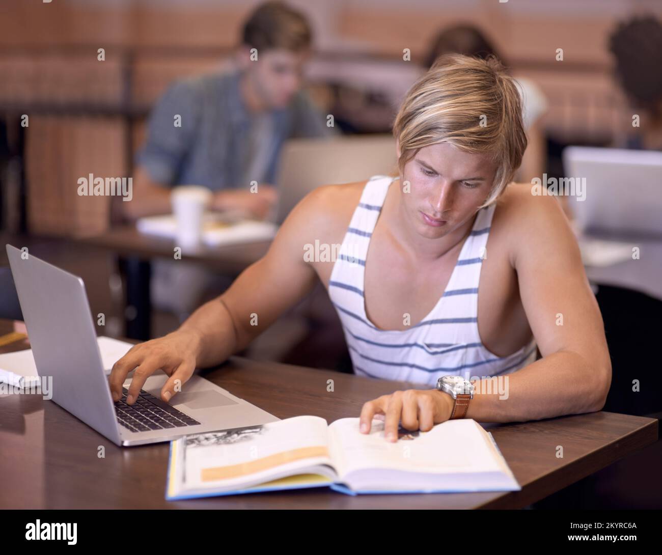 Coming to grips with the curriculum. a young college student using a ...