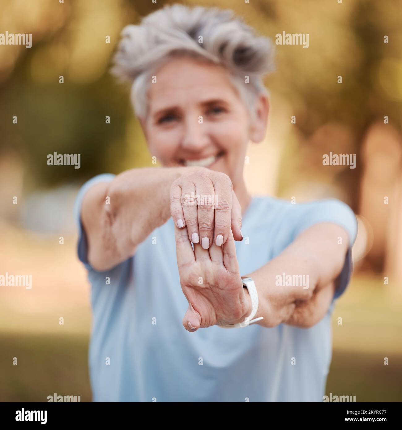 Senior woman, stretching arms and outdoor exercise for body care ...
