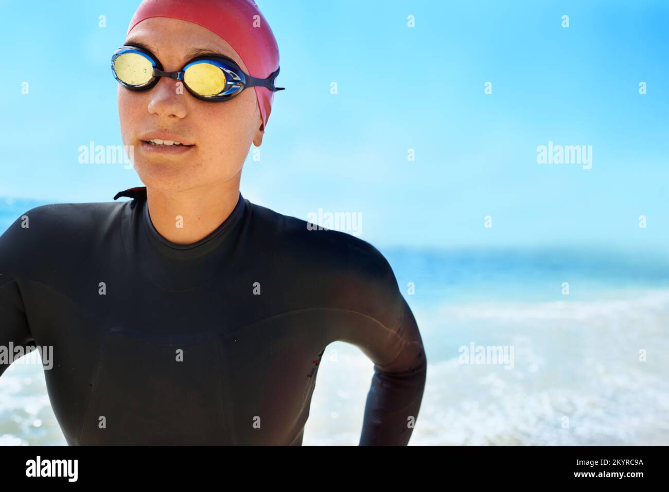 Training to be a lifesaver. A young woman training in a full piece ...