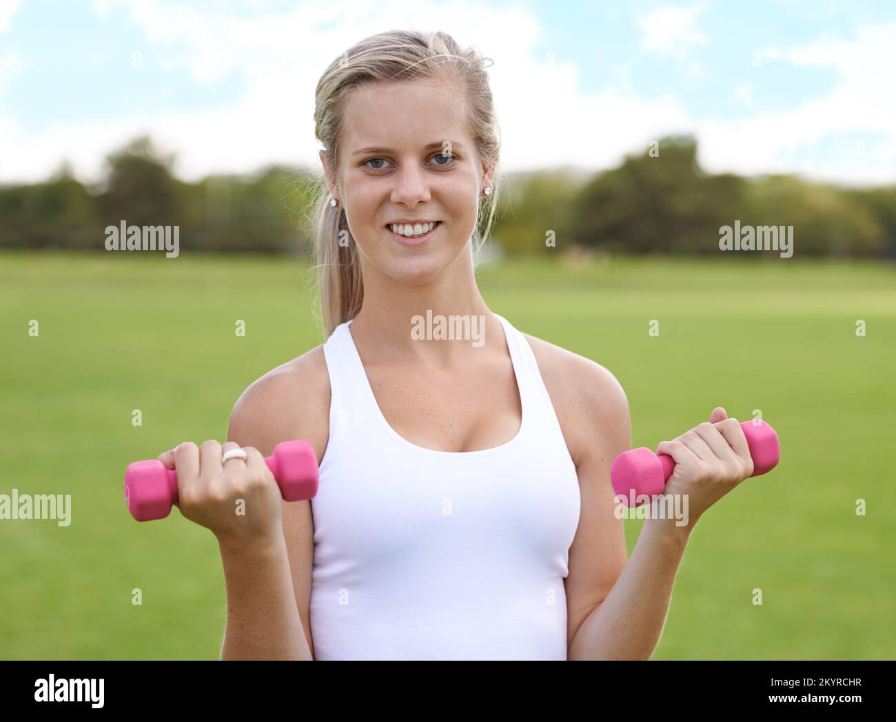 Sunshine and exercise. a group of young women exercising outdoors Stock ...