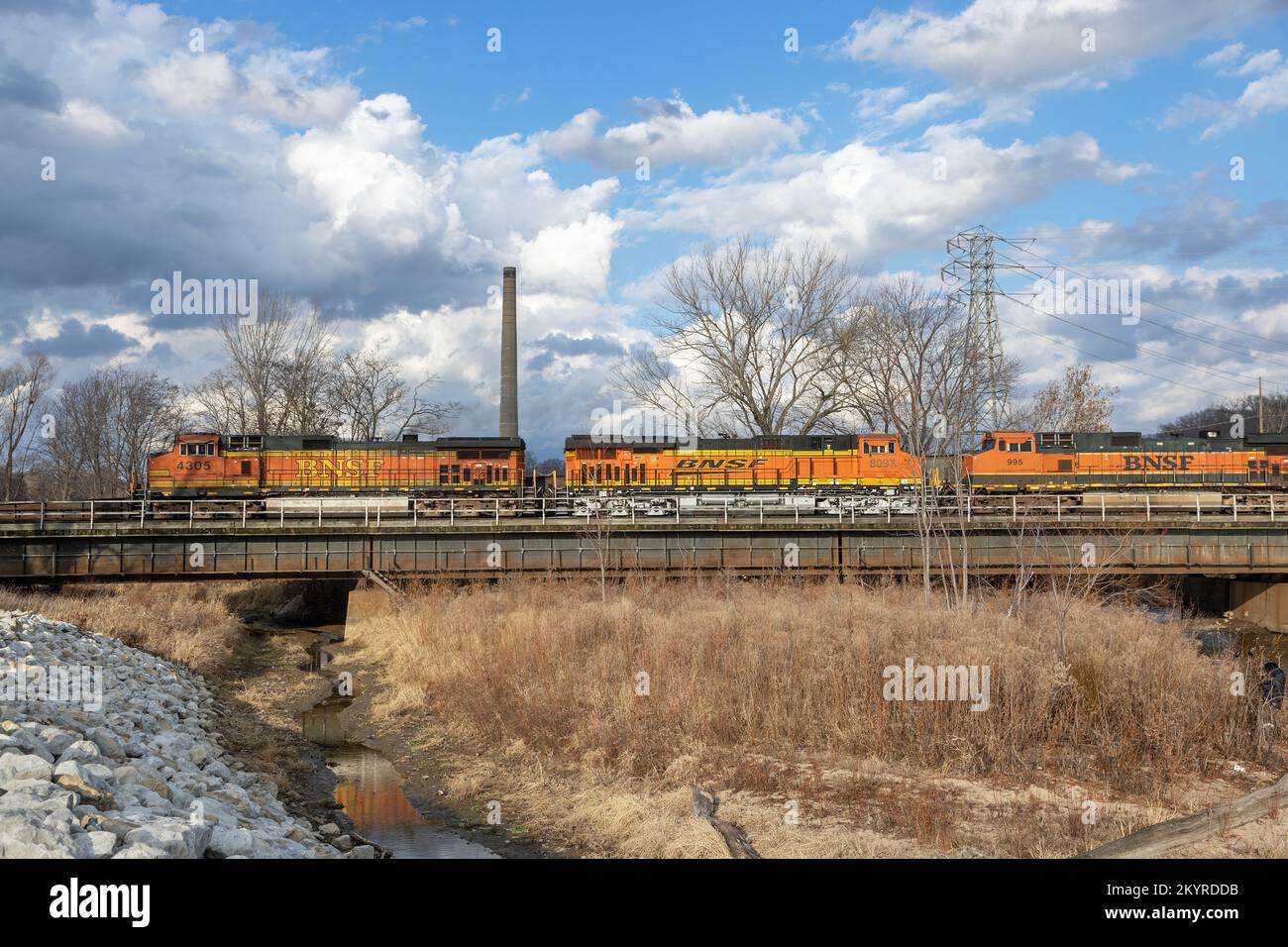 A westbound BNSF freight train crossing the Mississippi River on the Santa Fe Swing Span Bridge ...