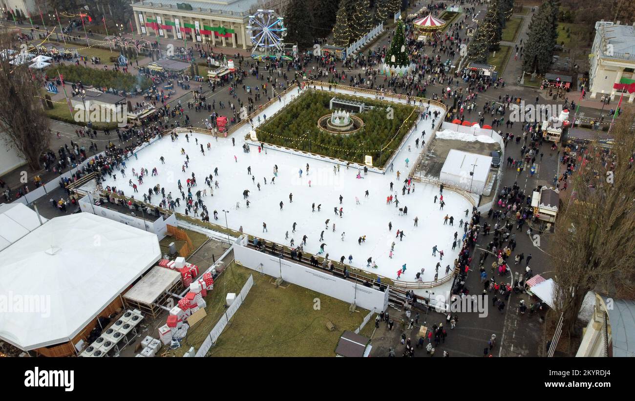 Aerial panoramic view cityscape urban park, outdoor ice skating rink ...