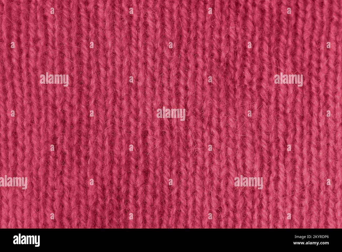 Trendy color of 2023 viva magenta. texture of knitted angora fabric ...
