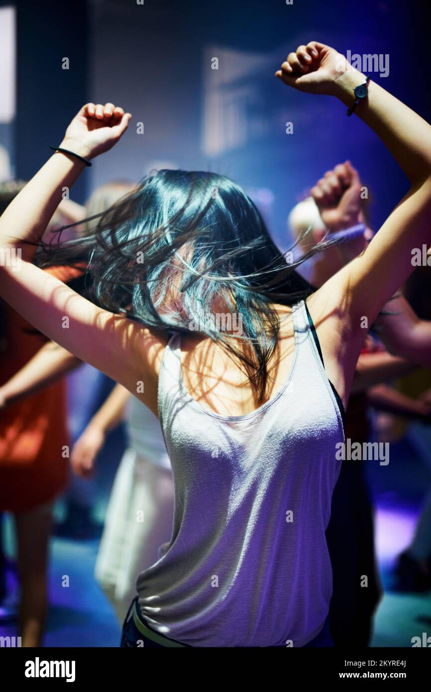 a young woman moving to the music with friends. This concert was ...