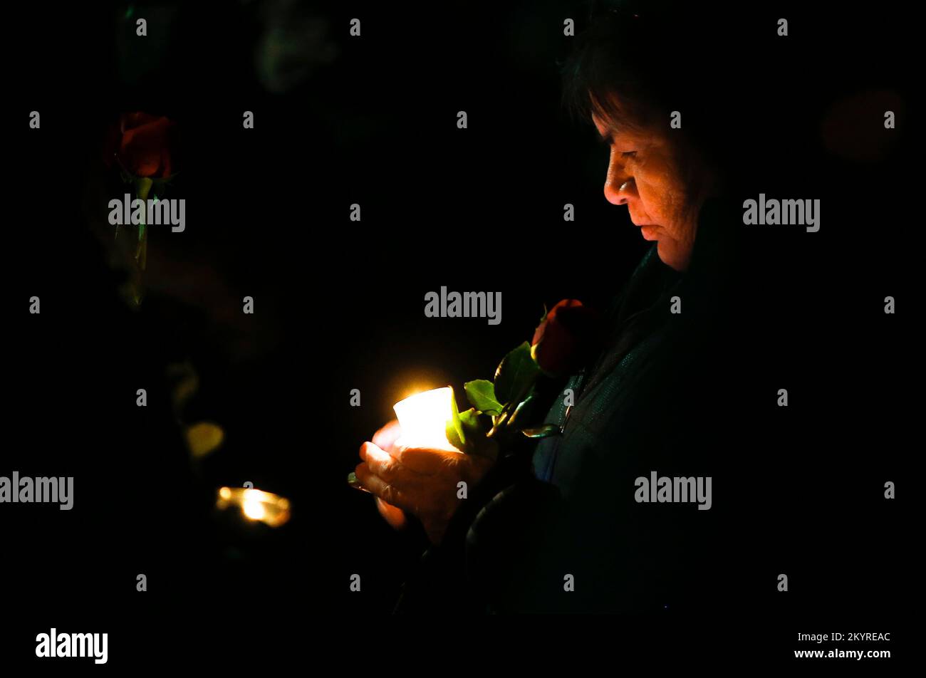 Family and friends of three murdered women gather at a vigil in ...
