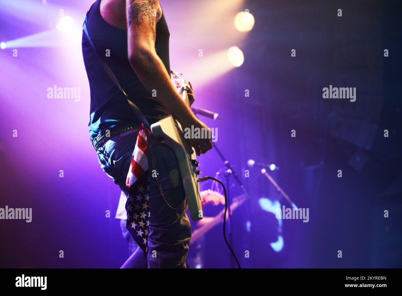 Rocking out. A band performing on stage. This concert was created for ...